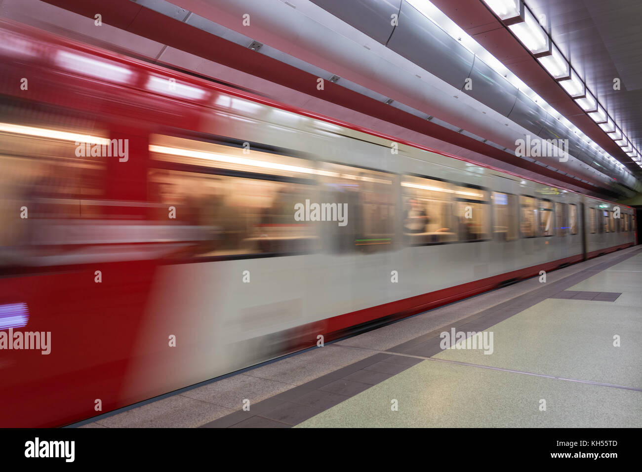 Moving red and white subway in the underground from the side Stock ...