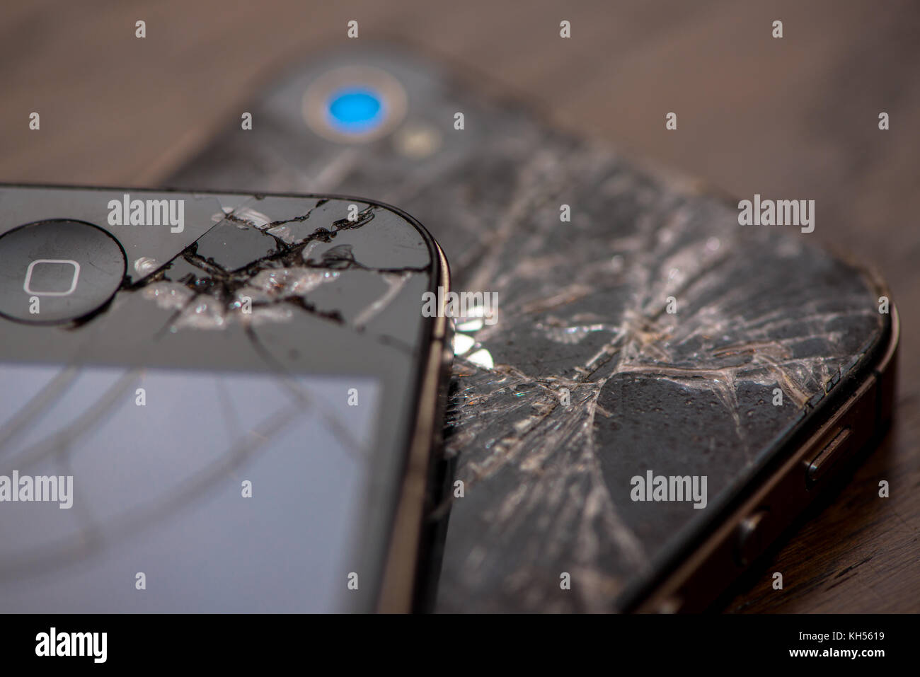 two smartphones, iphone, with broken glass Stock Photo - Alamy