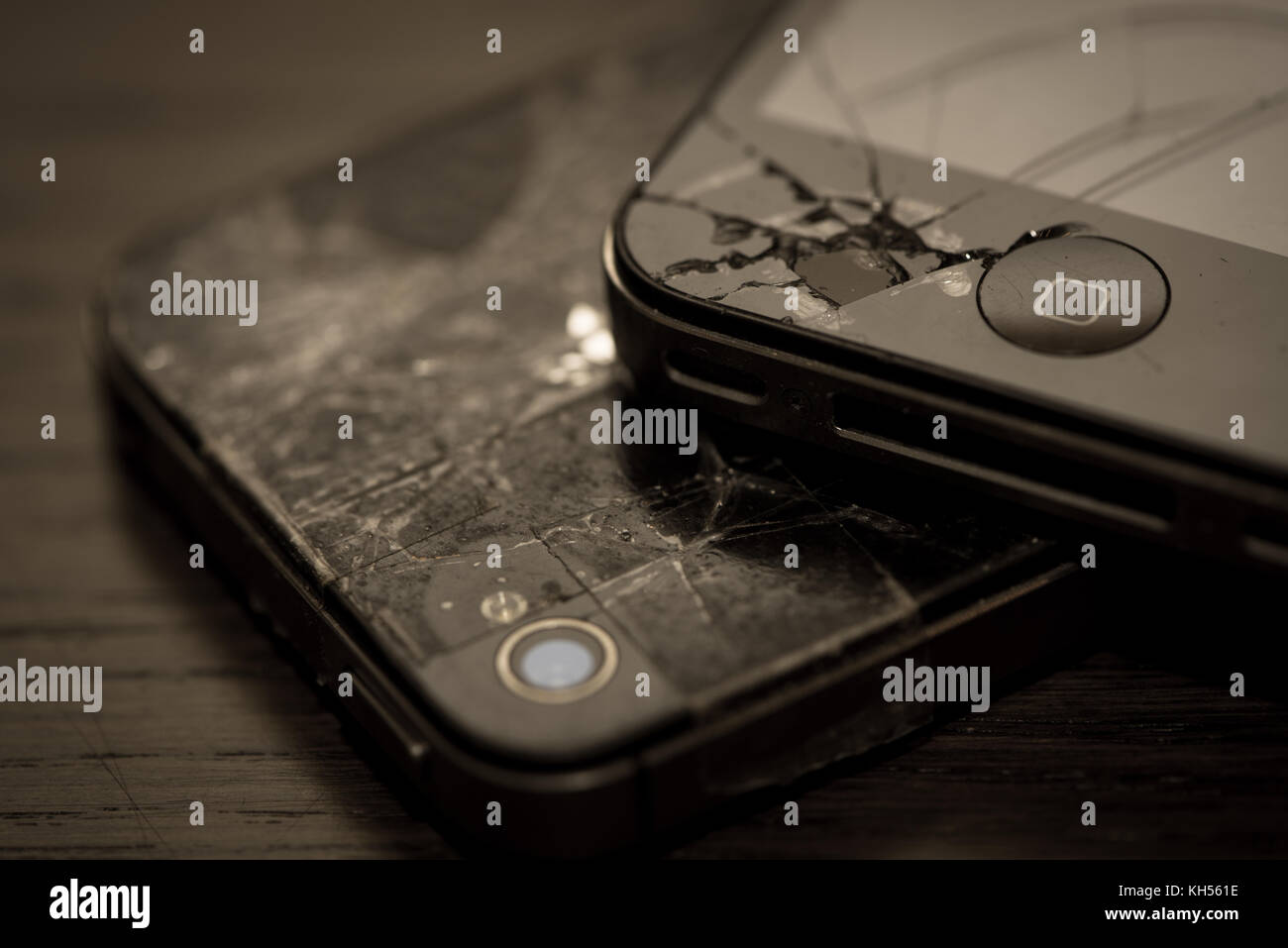 two smartphones, iphone, with broken glass Stock Photo - Alamy