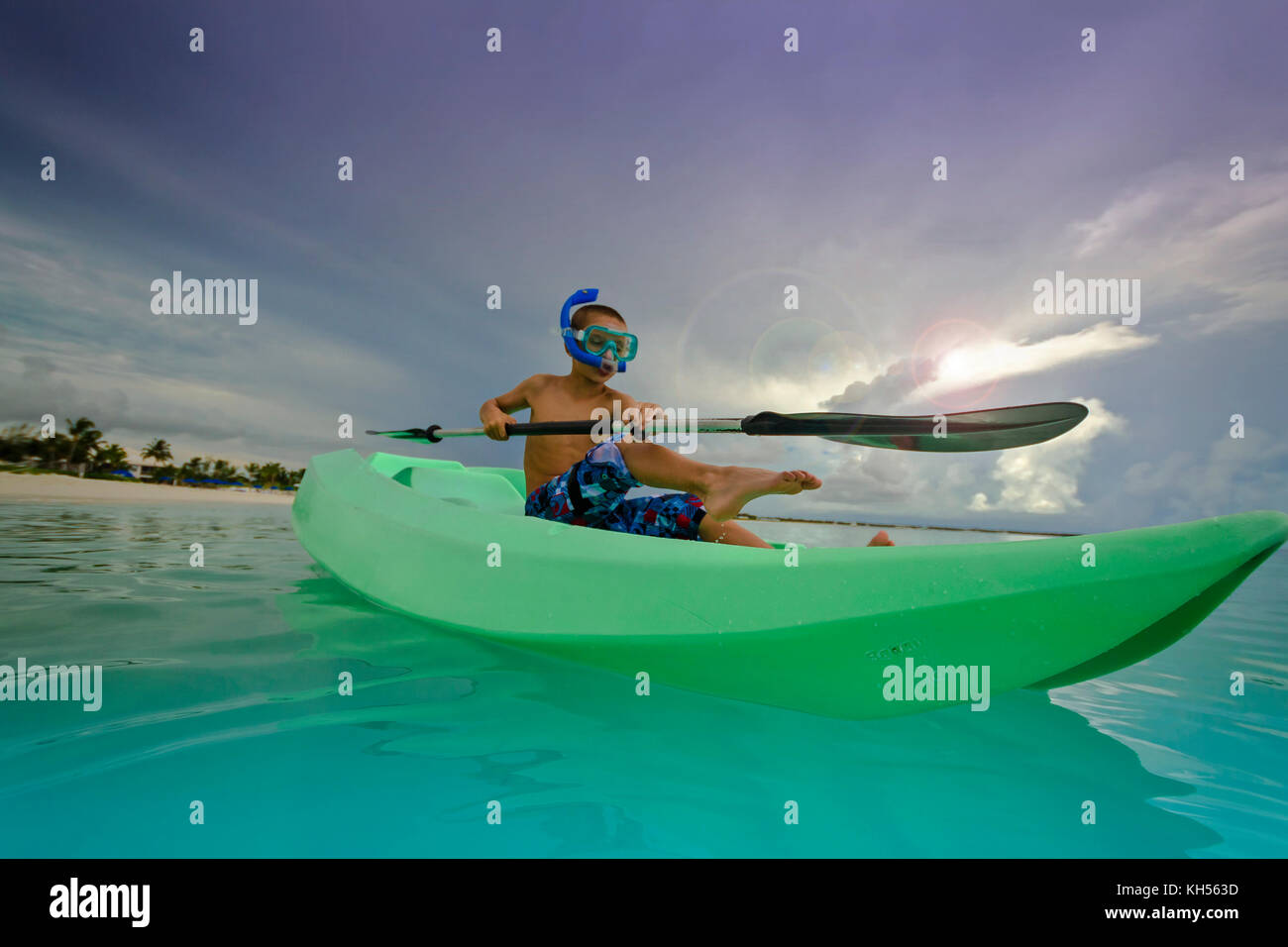 Young boy kayaking Stock Photo - Alamy
