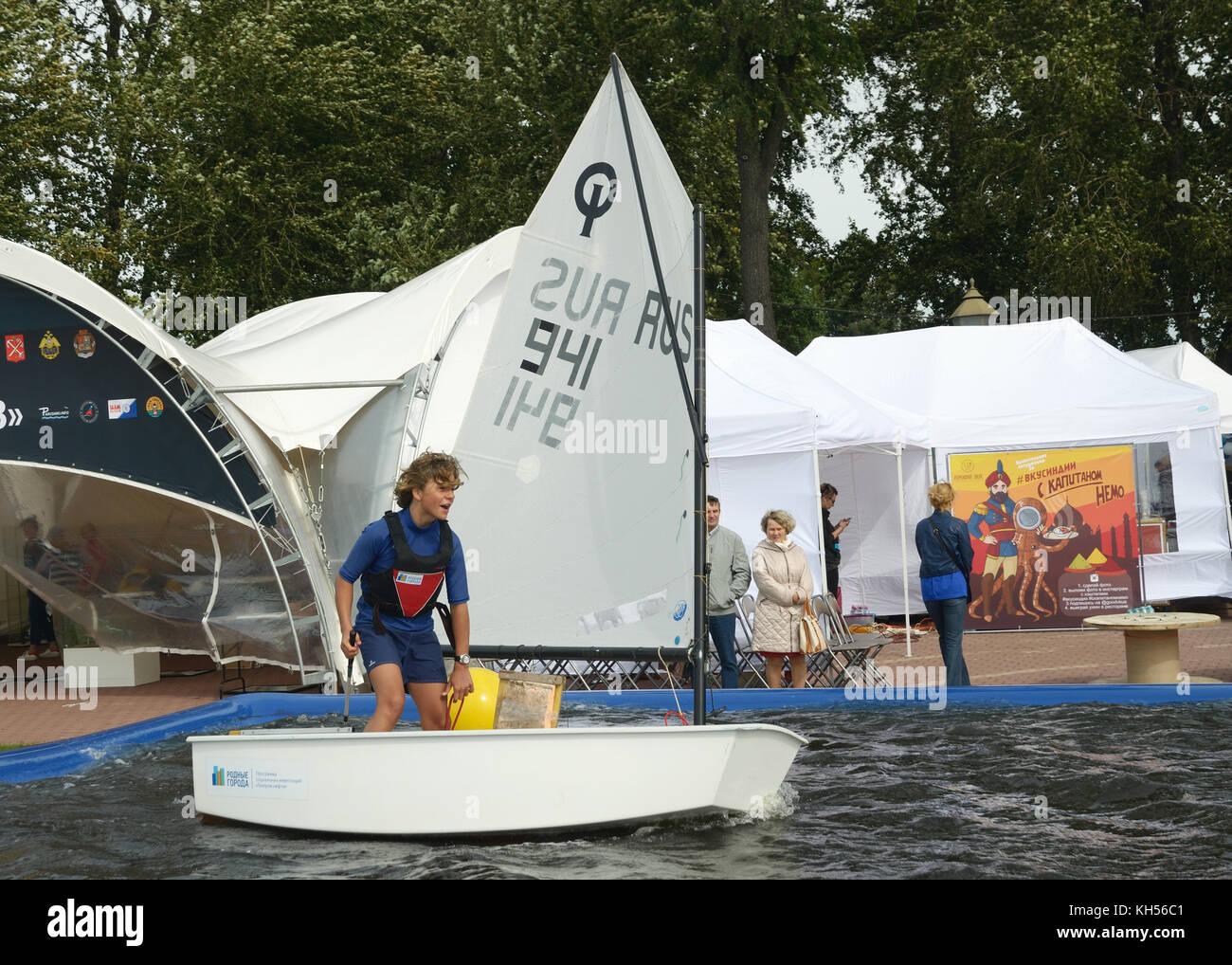 13.08.2016.Russia.Saint-Petersburg.Boy on a sailing boat floating in an ...