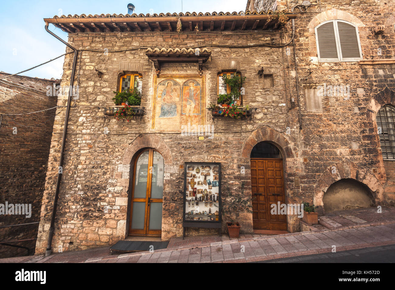 Assisi, Italy ancient building architecture; religious paint on facade ...