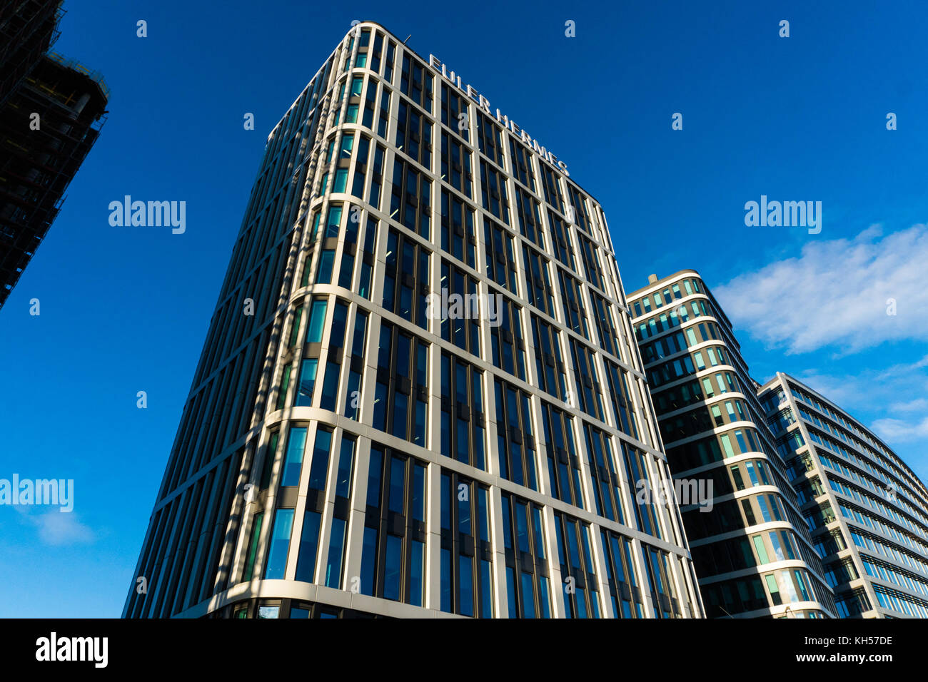 Tall building's glass window reflect daylight in town Stock Photo - Alamy