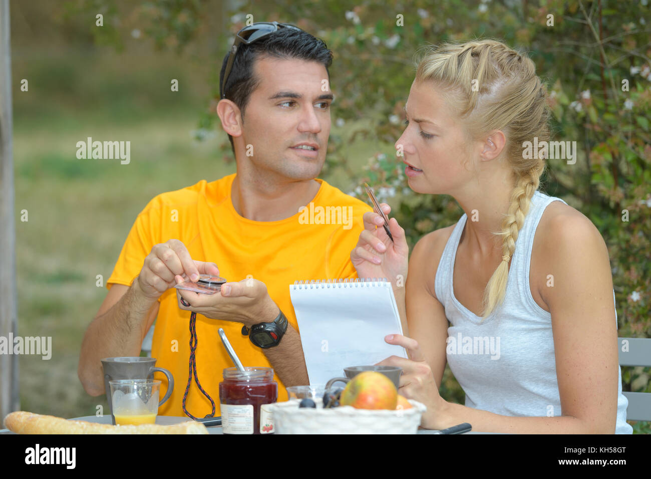 couple making notes while having breakfast Stock Photo - Alamy
