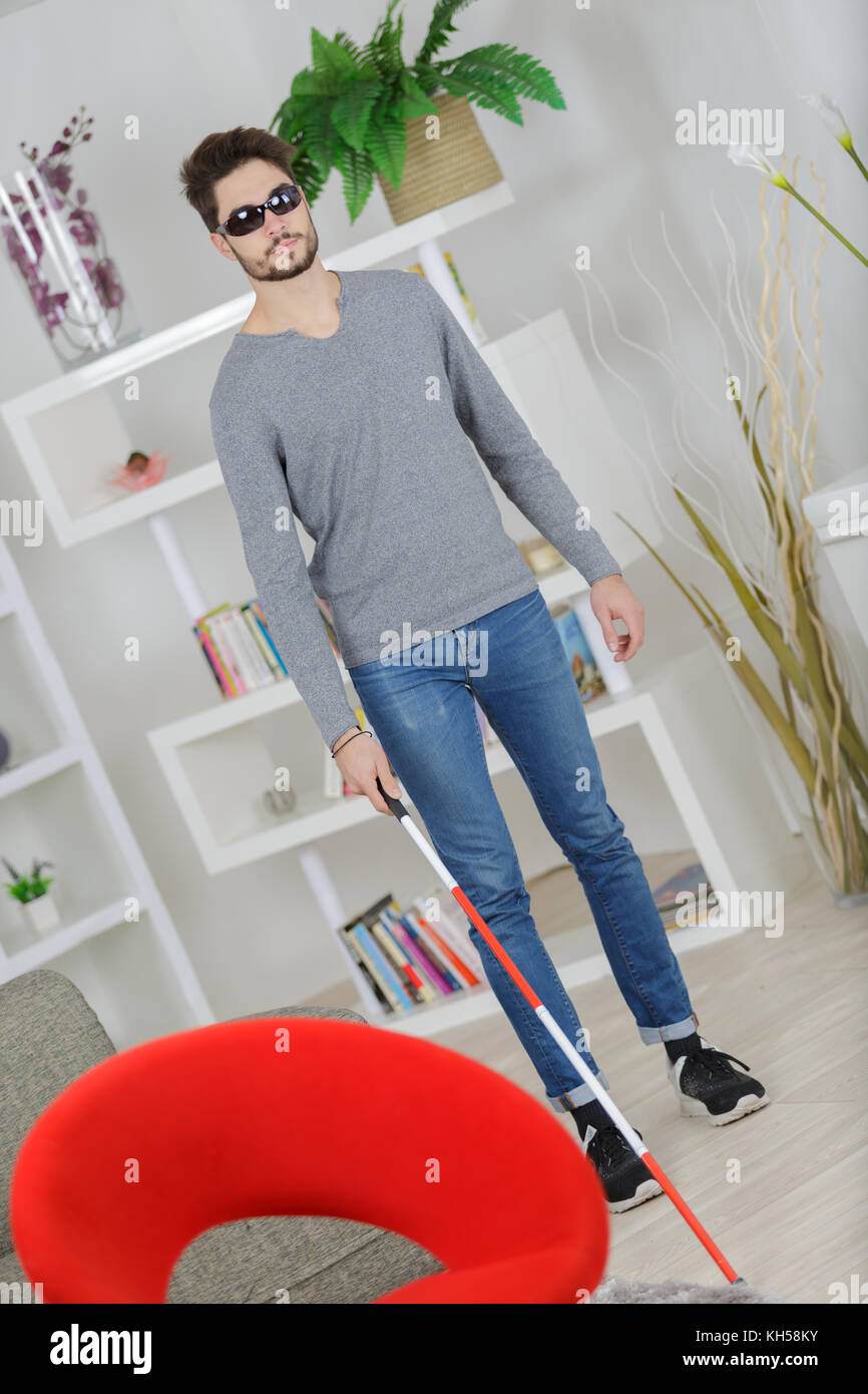 Blind man walking with cane hi-res stock photography and images - Alamy