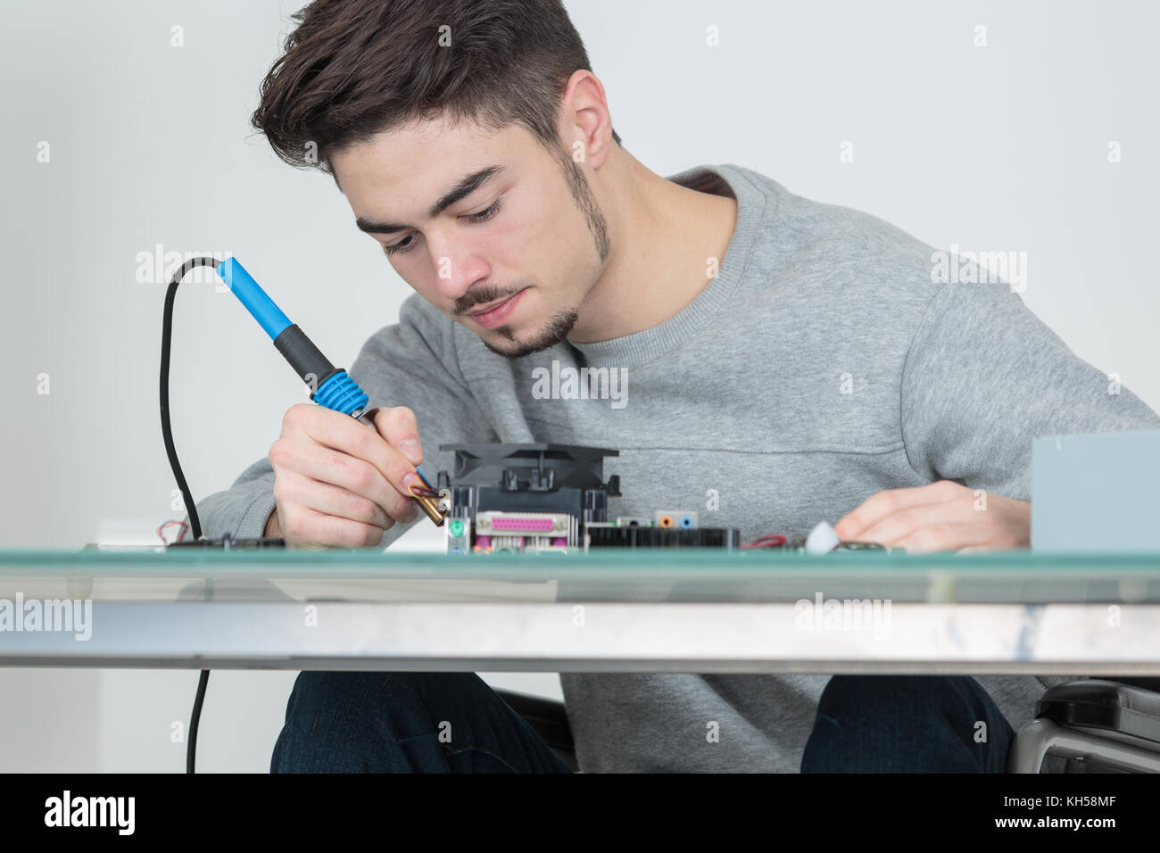 young handsome computer repairer concentrated on his work Stock Photo ...