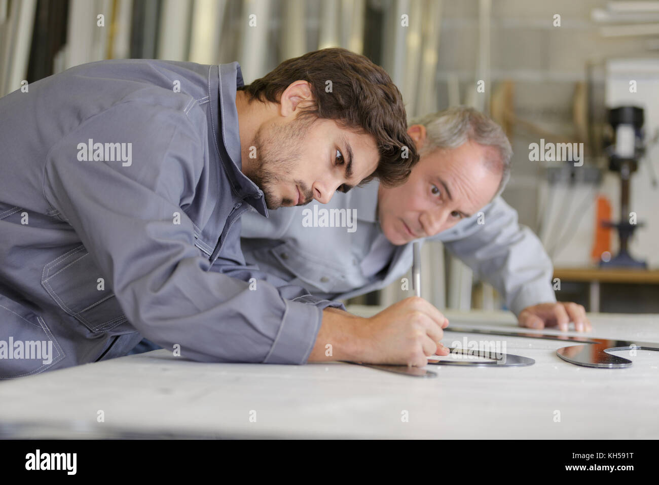 apprentice worker and his master Stock Photo - Alamy