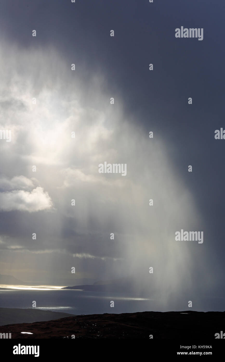 View of Rhum during a rain storm from the Isle of Skye Stock Photo - Alamy