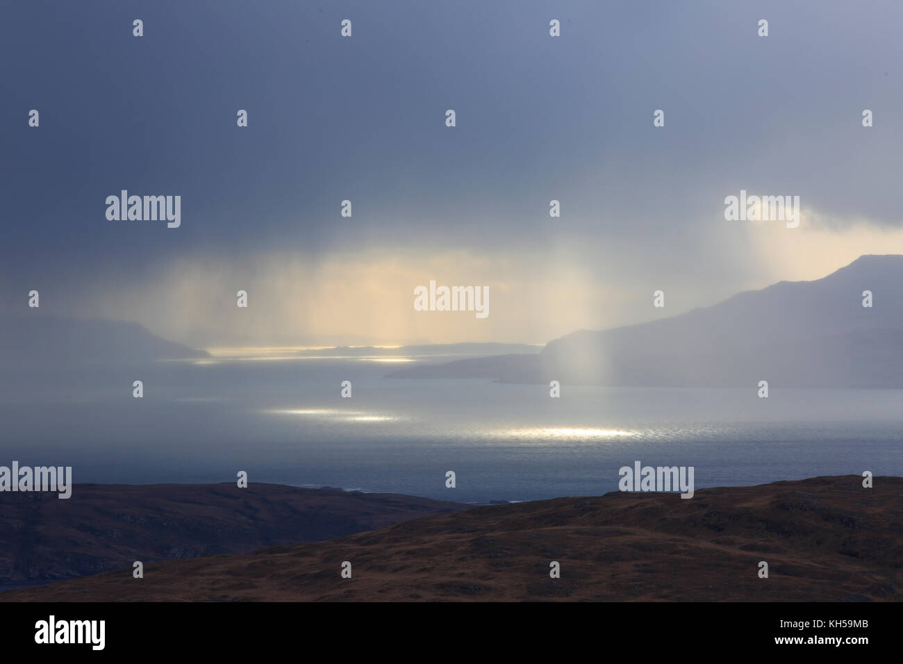 View of Rhum during a rain storm from the Isle of Skye Stock Photo - Alamy