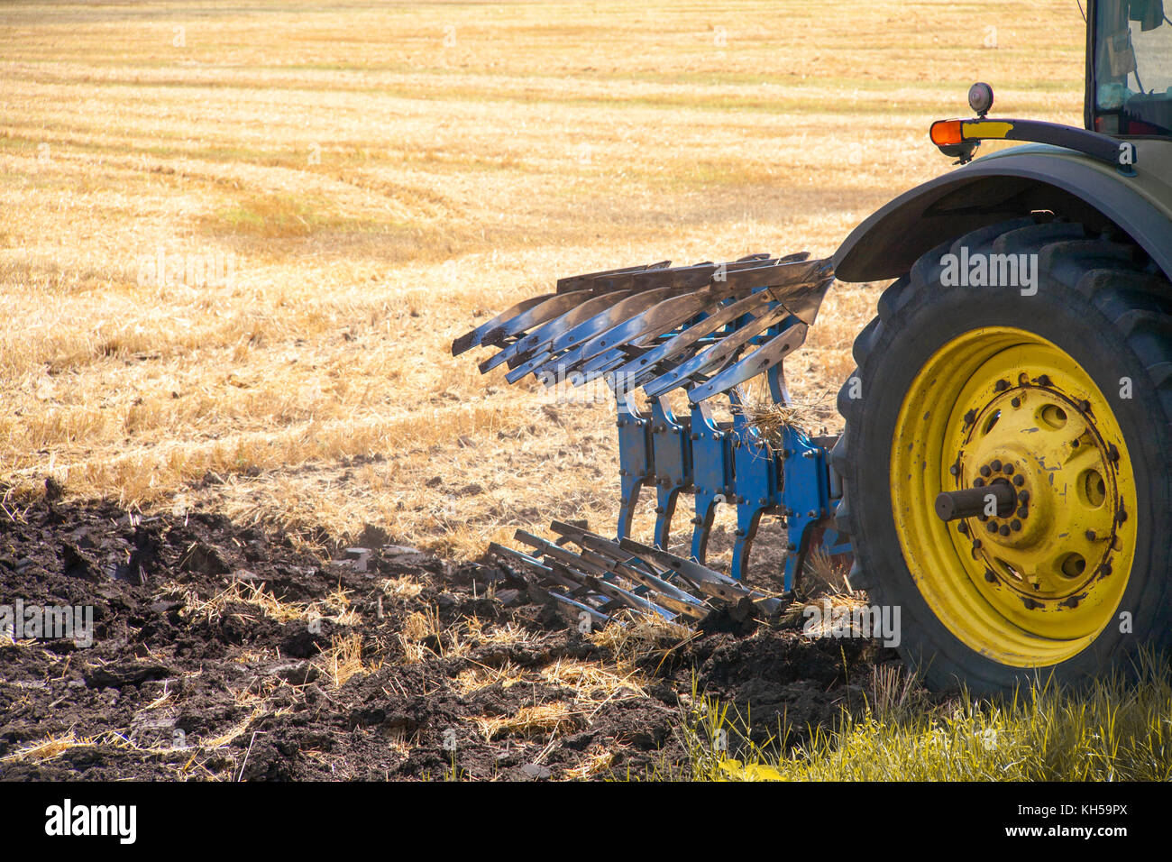 Tractor preparing land for sowing Stock Photo - Alamy