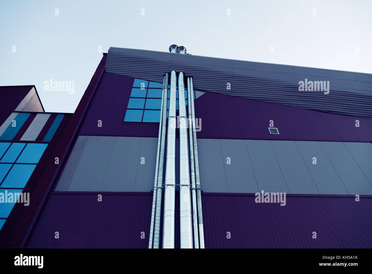 A burgundy building with trumpets against the sky Stock Photo - Alamy