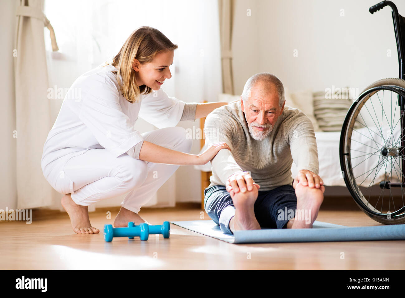 Health visitor and senior man during home visit Stock Photo - Alamy