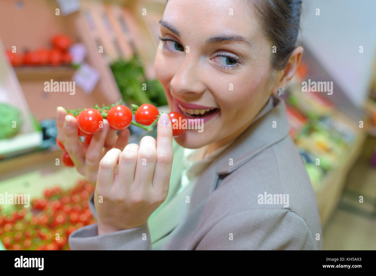 teasing to eat the tomatoes Stock Photo - Alamy