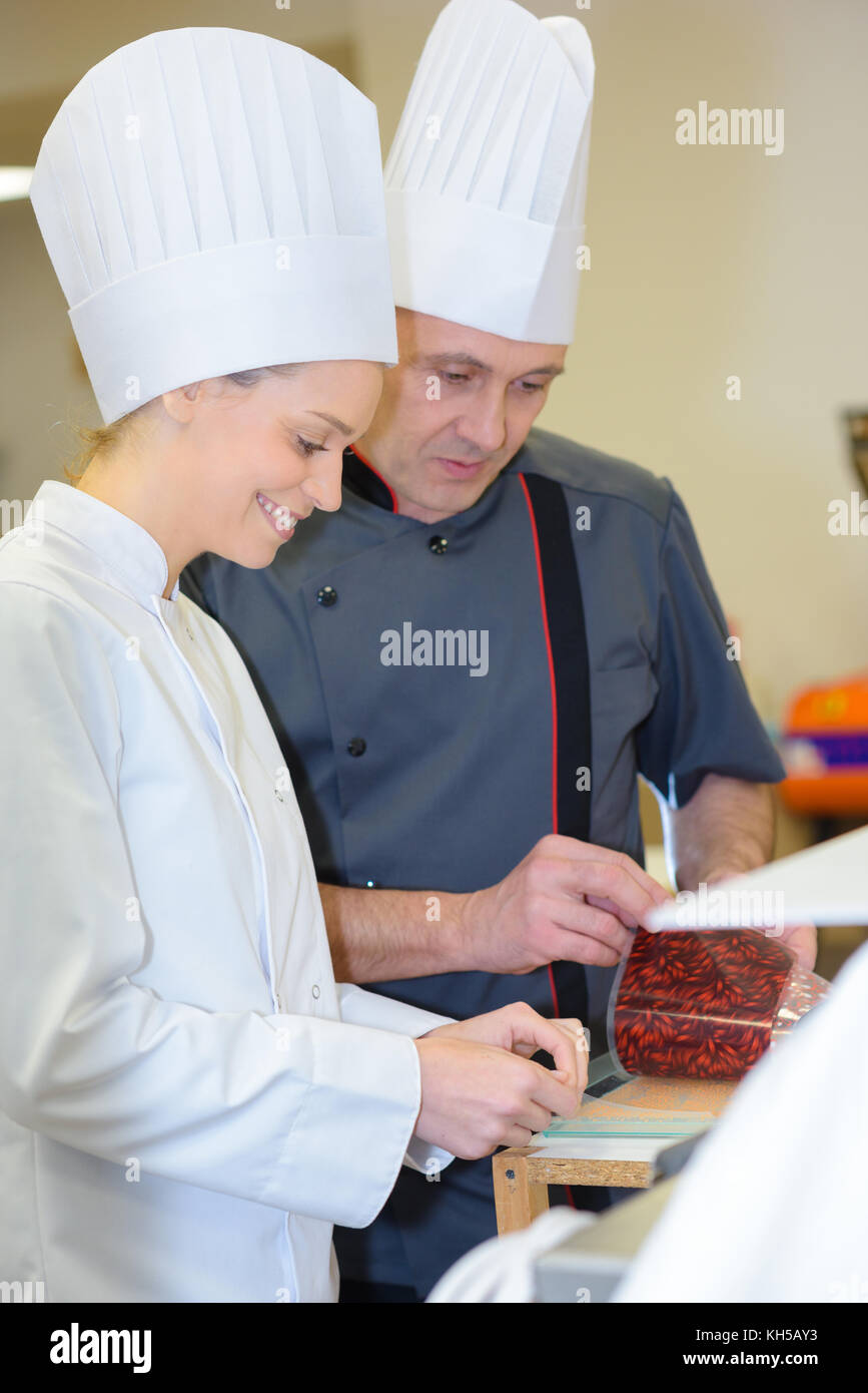 team of chefs working together in the kitchen Stock Photo - Alamy