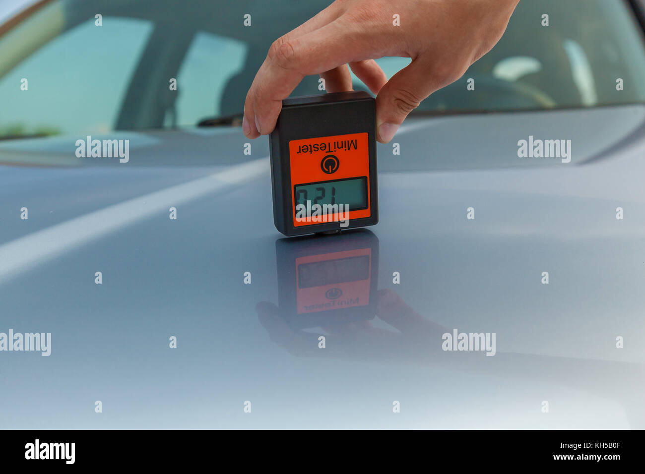 car body check.Instrument check paint thickness by car Stock Photo - Alamy