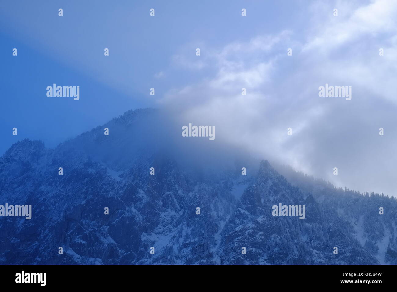 Sun rays over the mountains in winter Stock Photo - Alamy