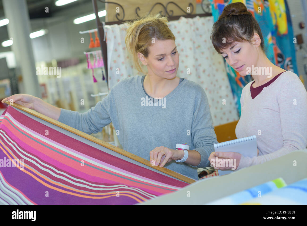 Women looking at textiles Stock Photo - Alamy
