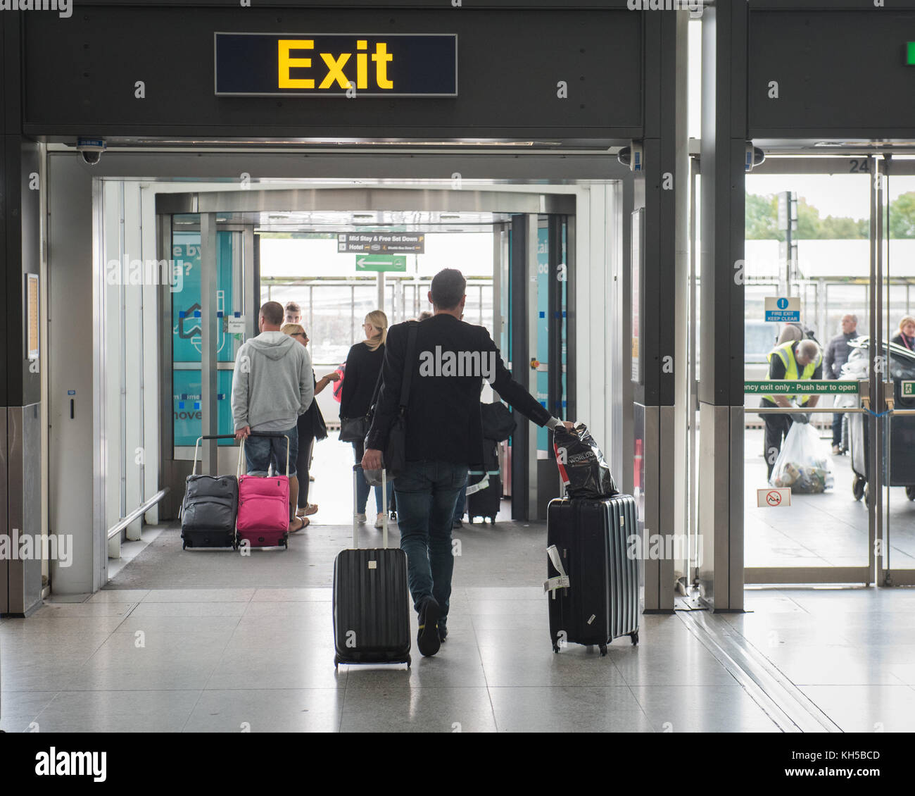 People leaving Stansted Airport via EXIT sign from International ...