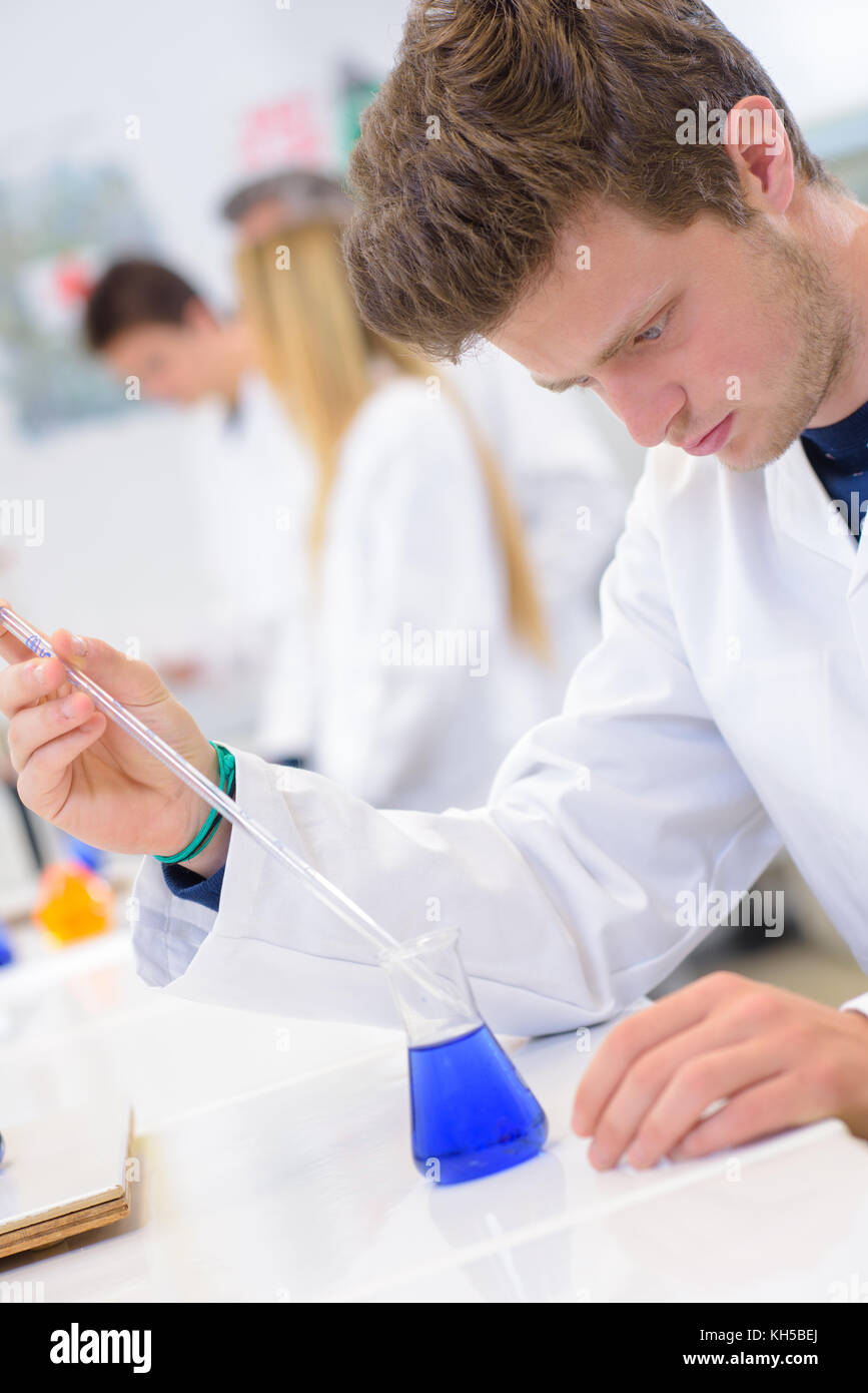 Young man conducting scientific hi-res stock photography and images - Alamy
