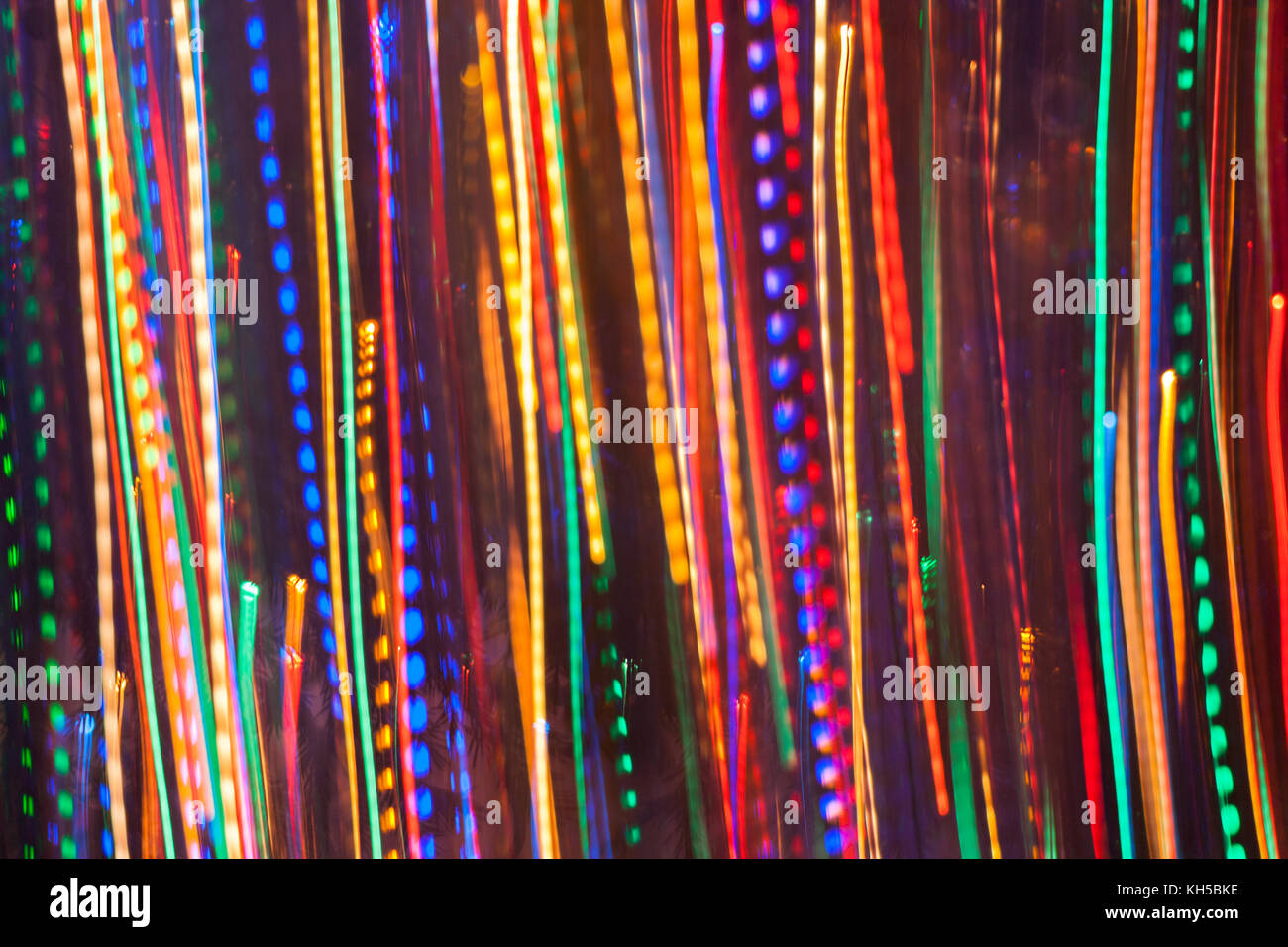 Abstract background of bright glowing multicolored vertical solid and ...