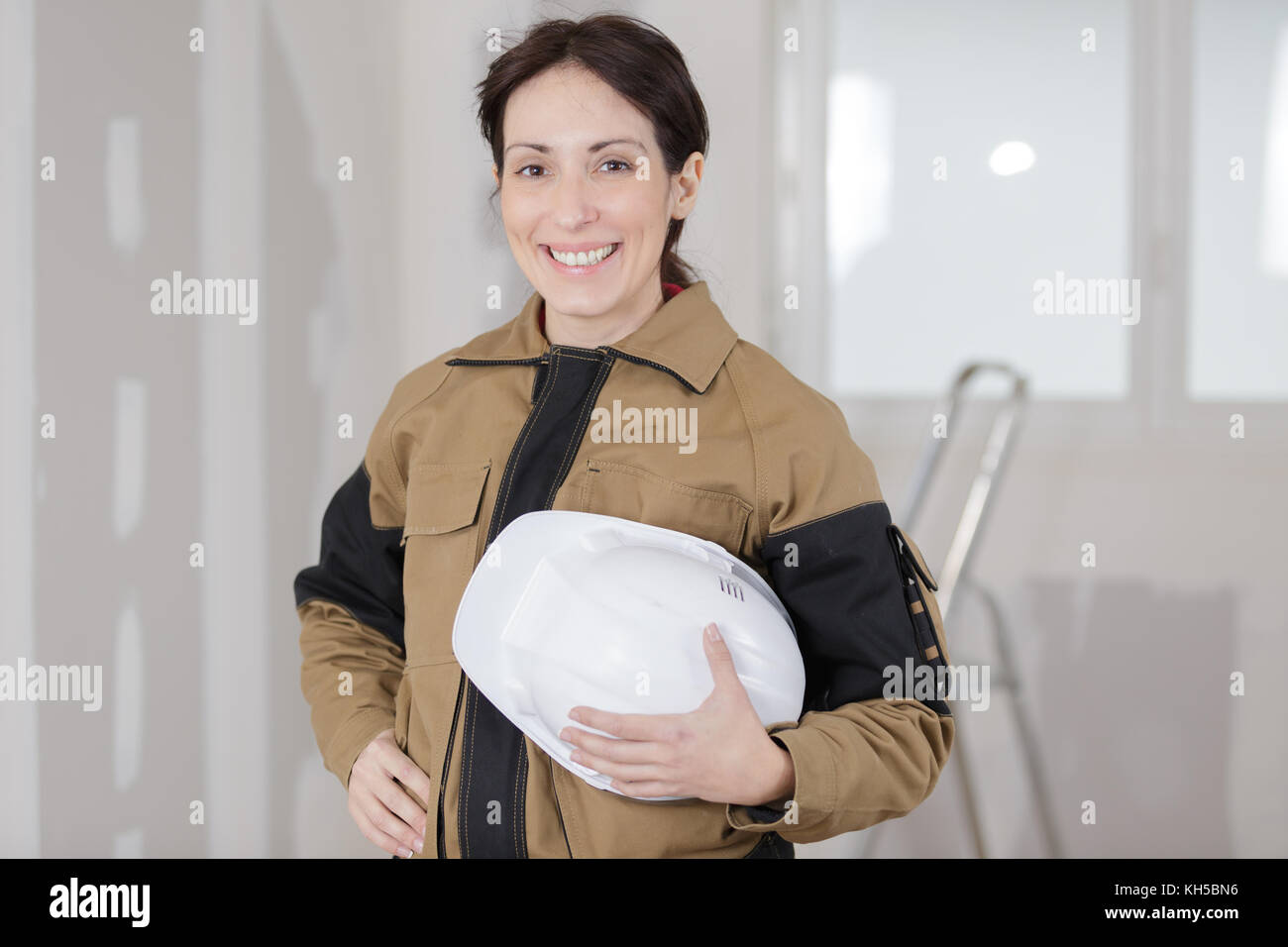 happy female builder on site Stock Photo - Alamy