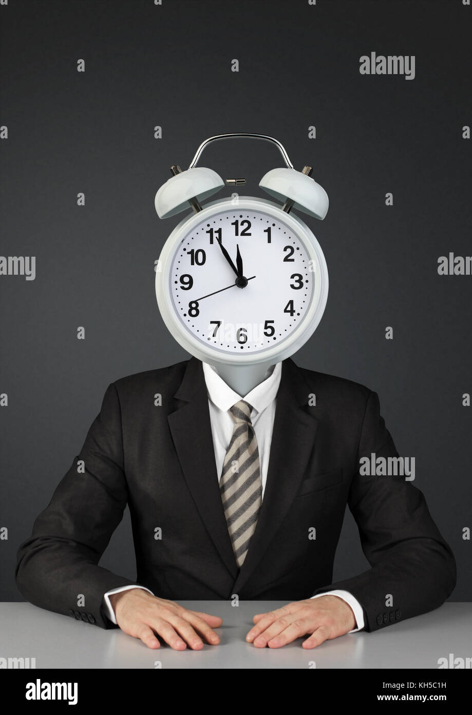 Businessman with ringing clock instead of head, time limit concept ...