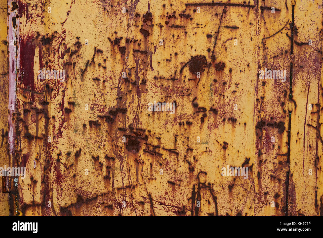 Rusty yellow painted metal wall. Rusty metal background with strips of ...