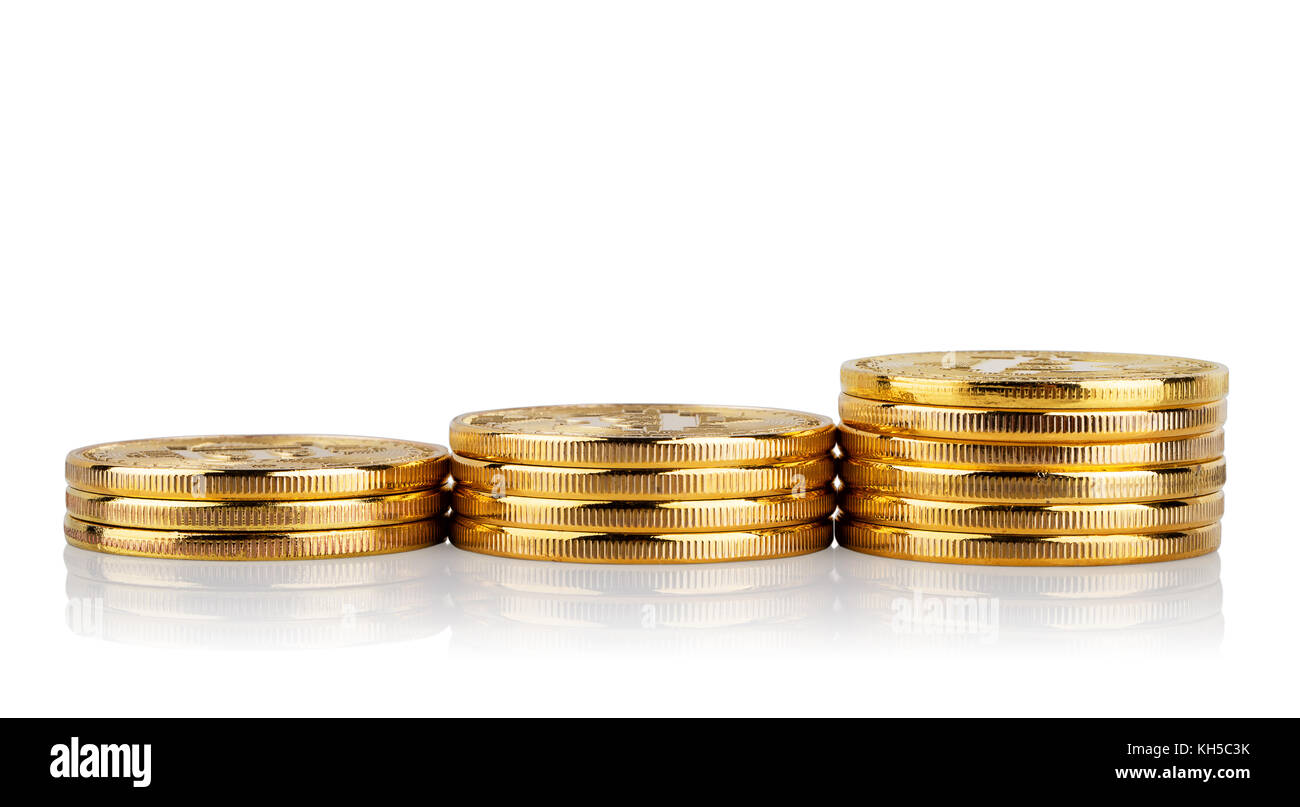 Rising stacks of coins isolated on white background Stock Photo - Alamy