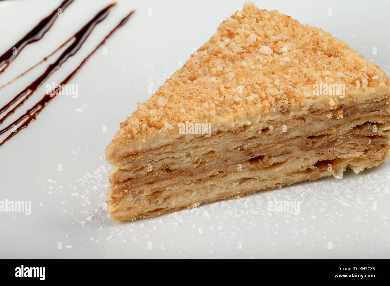 A piece of cake Napoleon on a plate. Classic Napoleon cake Stock Photo ...