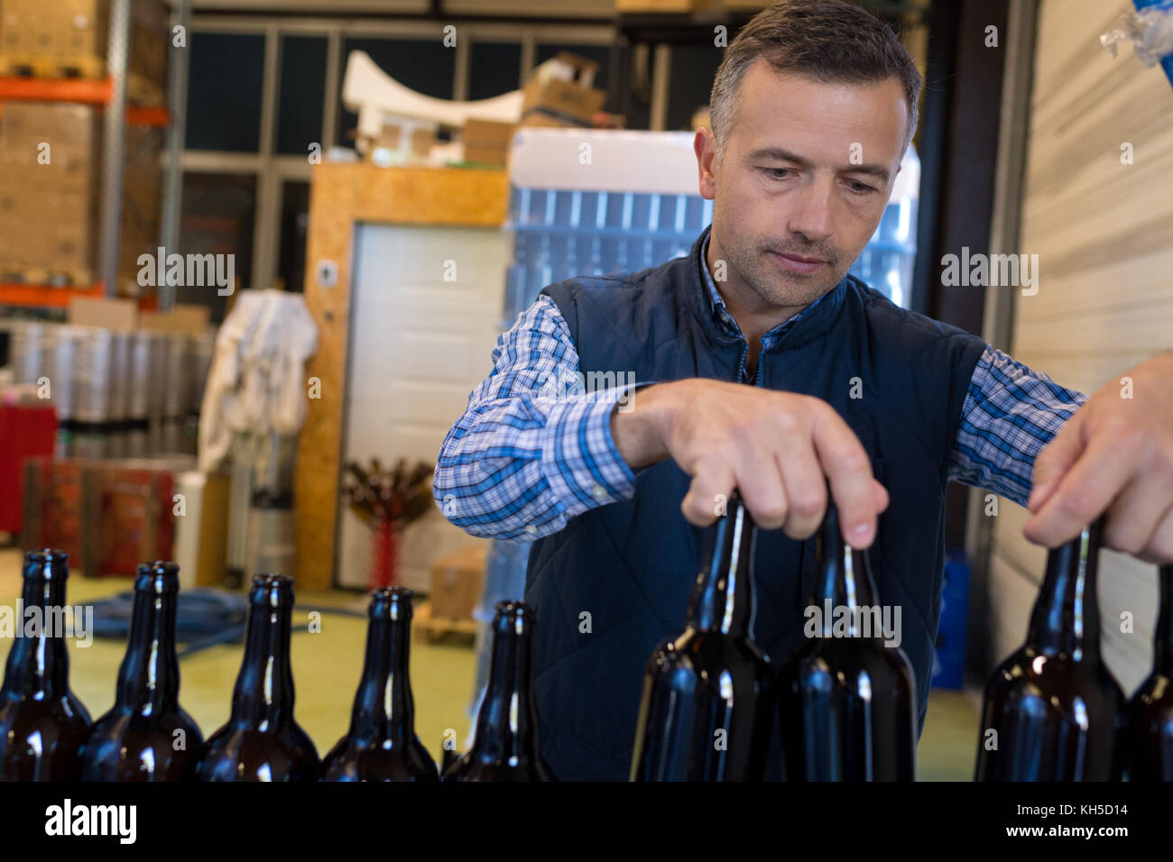 handsome packer on the packaging line at the manufacture Stock Photo ...