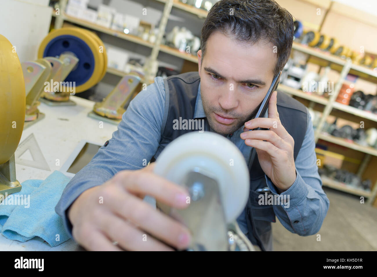 male supervisor talking on mobile phone in industry Stock Photo - Alamy