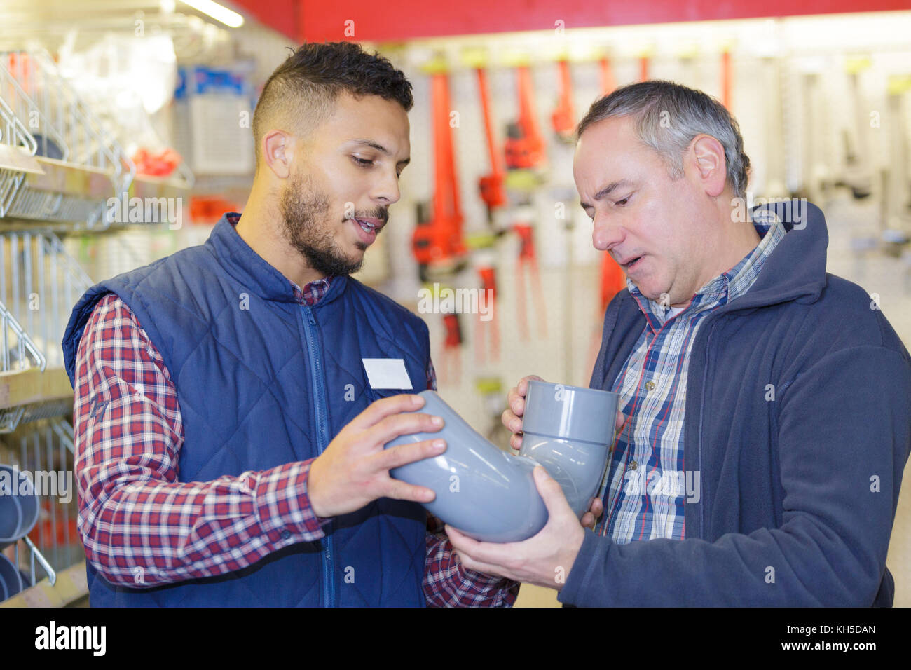 plumbers merchant with worker Stock Photo - Alamy