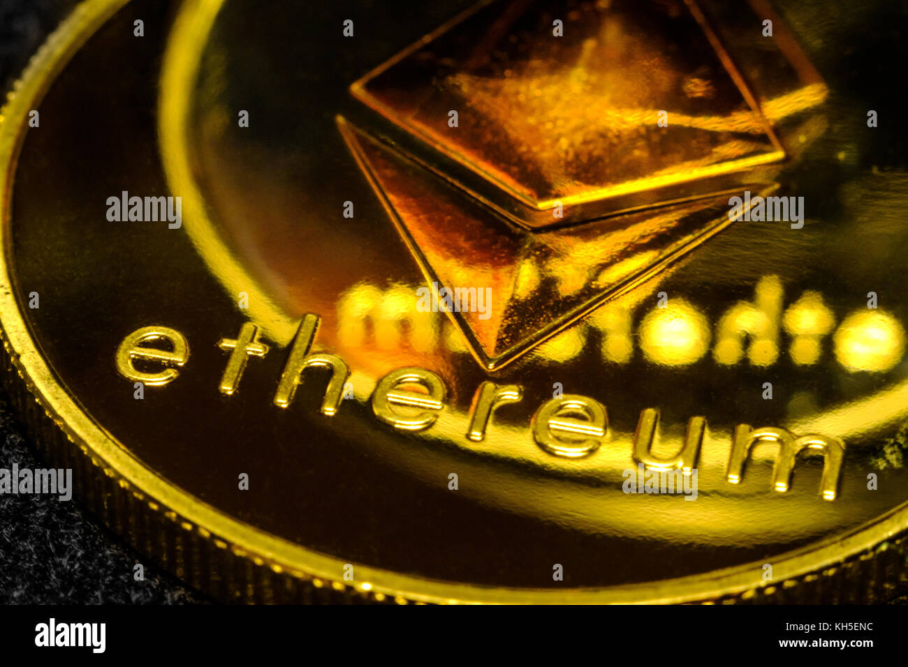 Ethereum macro symbol sign close-up golden Stock Photo - Alamy