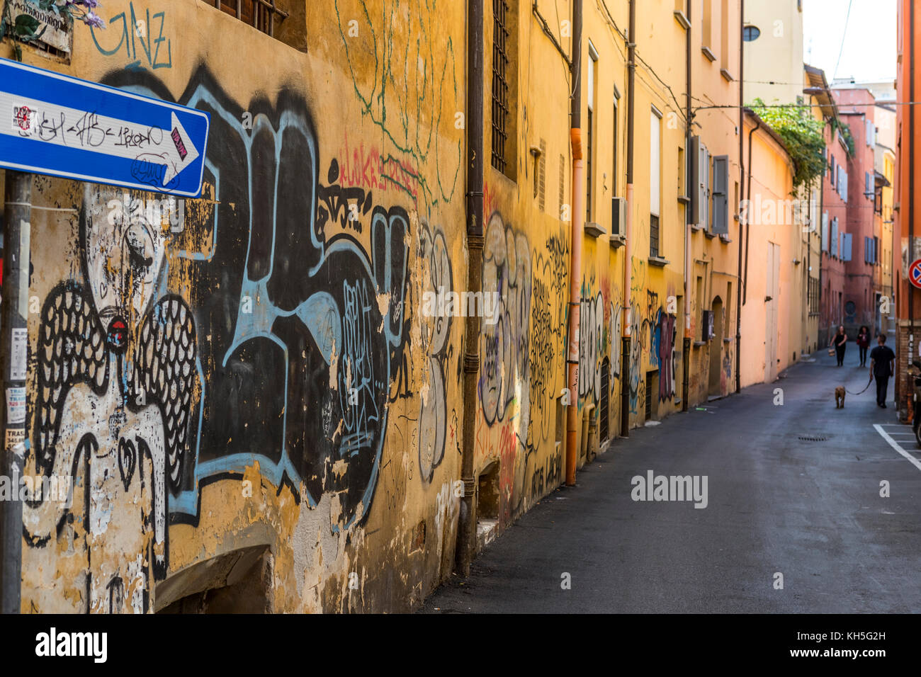 street sign, graffiti art and locals, Bologna city life, Italy Stock ...