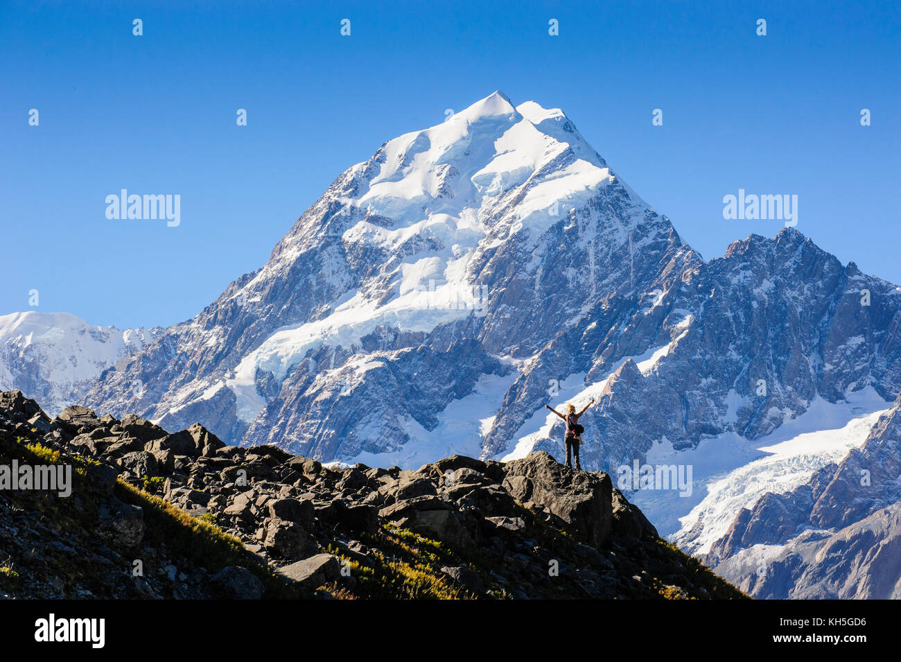 Woman posing before Mount Cook National Park, South Island, New Zealand ...