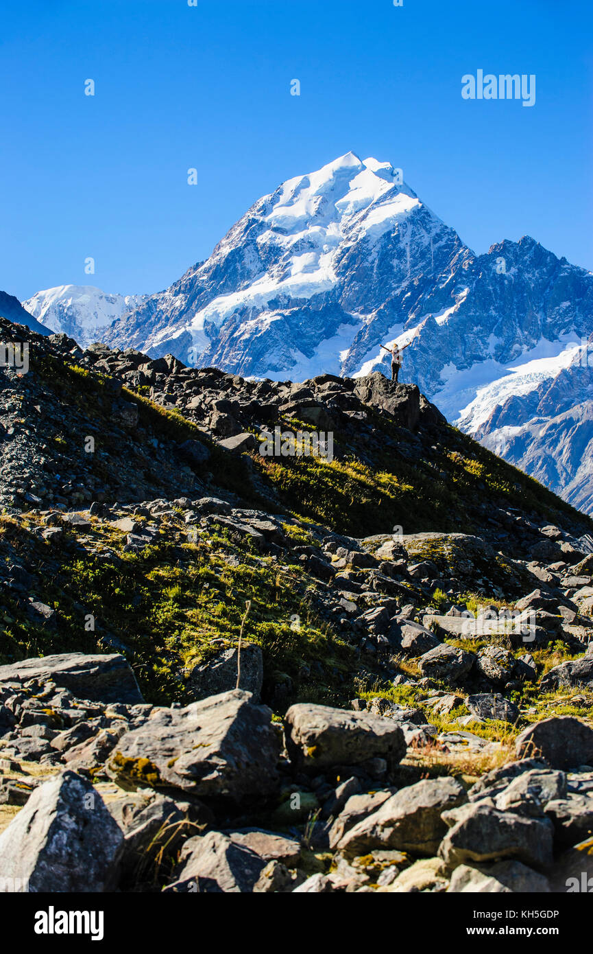 Woman posing before Mount Cook National Park, South Island, New Zealand ...