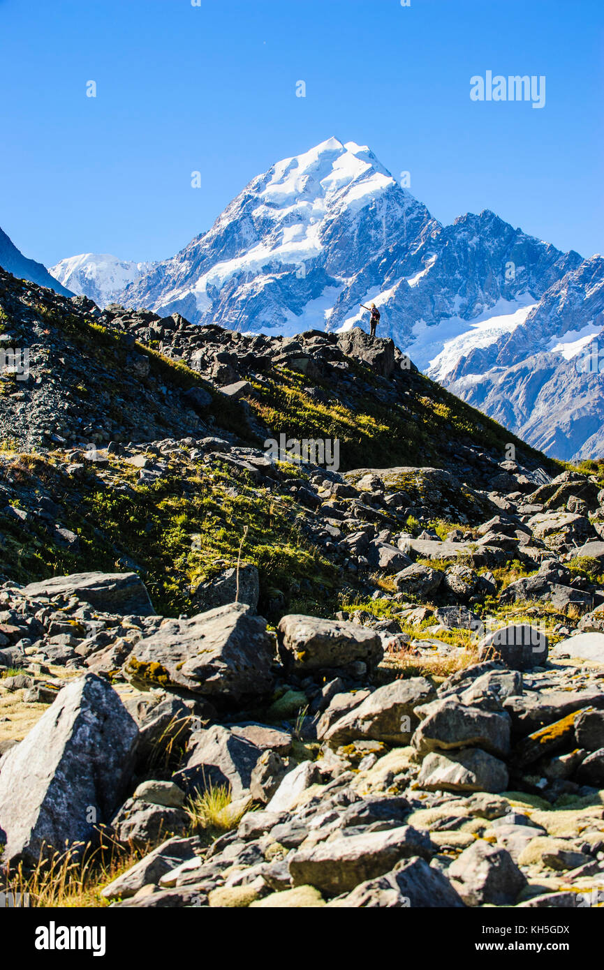Woman posing before Mount Cook National Park, South Island, New Zealand ...