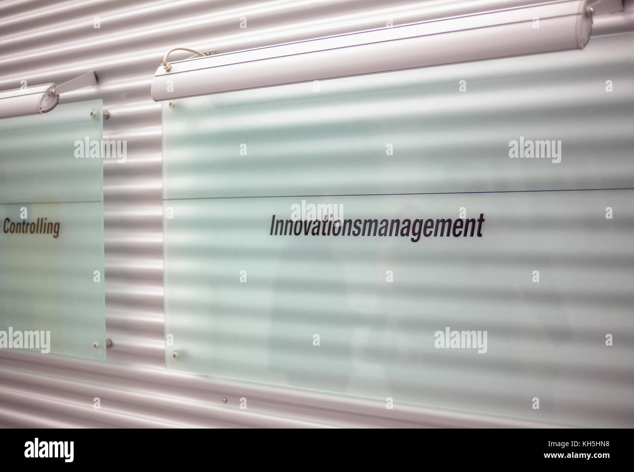 Textual commercial message printed on white glass Stock Photo - Alamy