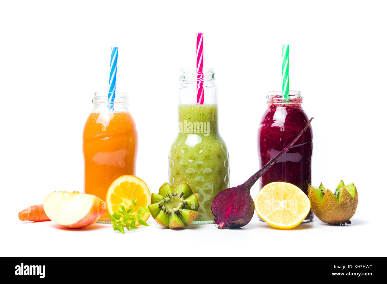Colorful smoothies with fruits isolated on white Stock Photo - Alamy