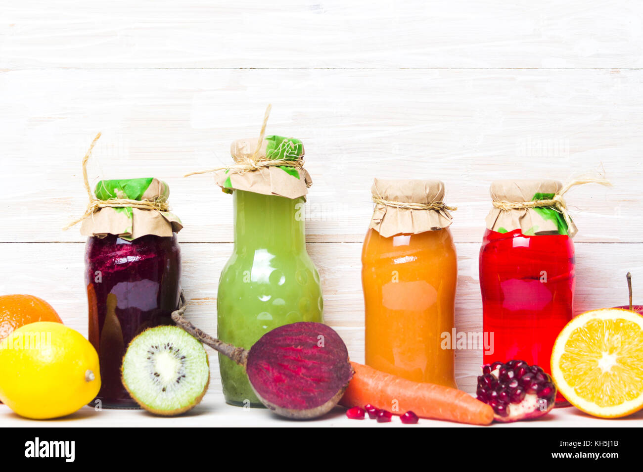 Colorful fresh juices with fruits isolated on white Stock Photo - Alamy