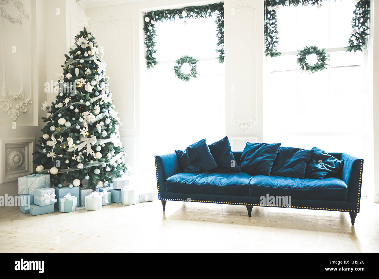 Christmas living room with a Christmas tree, sofa, gifts and a large ...