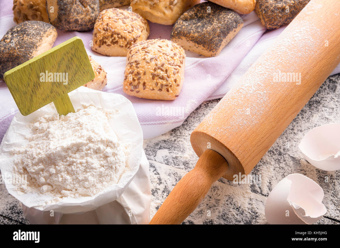 Food ingredients theme with a bag of flour with a blank wooden banner ...