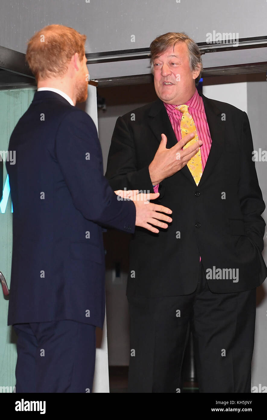 Prince Harry is greeted by President of Mind Stephen Fry as he arrives ...