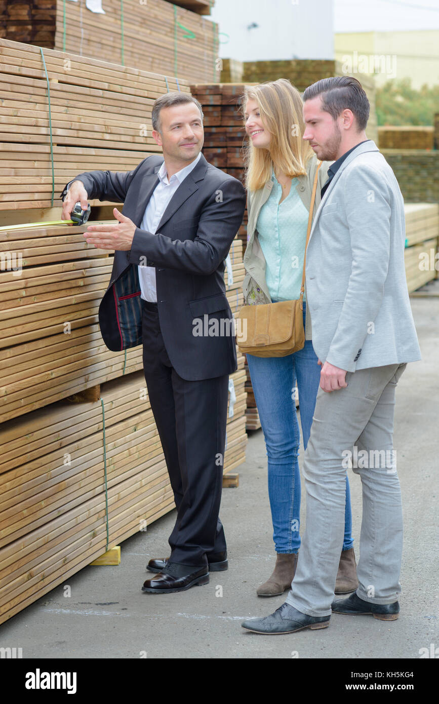 couple checking wood stored Stock Photo - Alamy