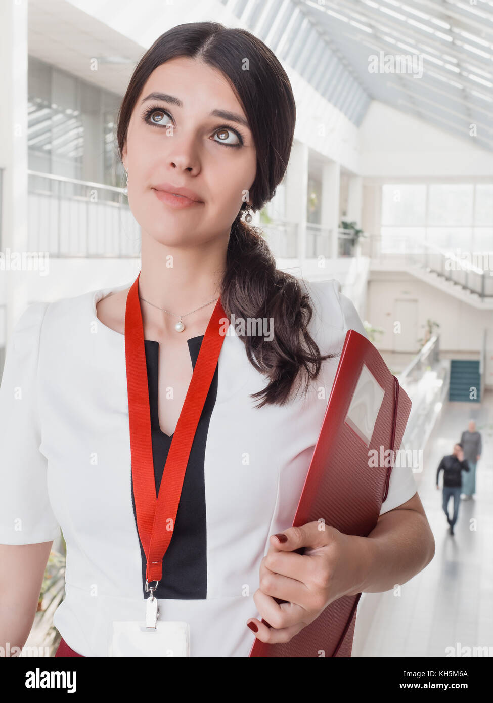 Beautiful Smiling Businesswoman Standing Against White Offices ...