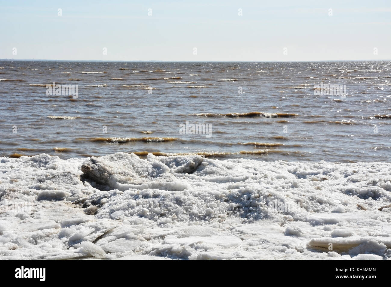 Coastal line with ice and sea. Spring season Stock Photo - Alamy