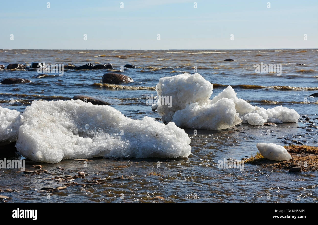 Coastal line with ice and sea. Spring season Stock Photo - Alamy