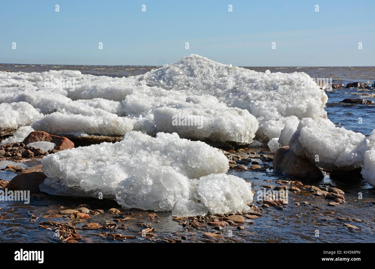Coastal line with ice and sea. Spring season Stock Photo - Alamy
