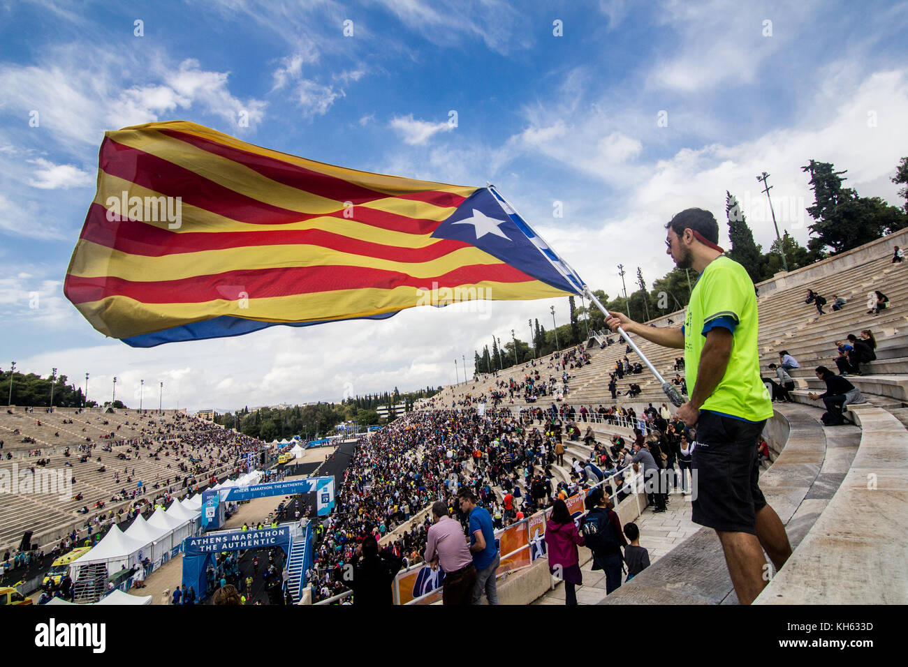 A spectator waves a Catalonian flag during the race. The 35th Athens ...
