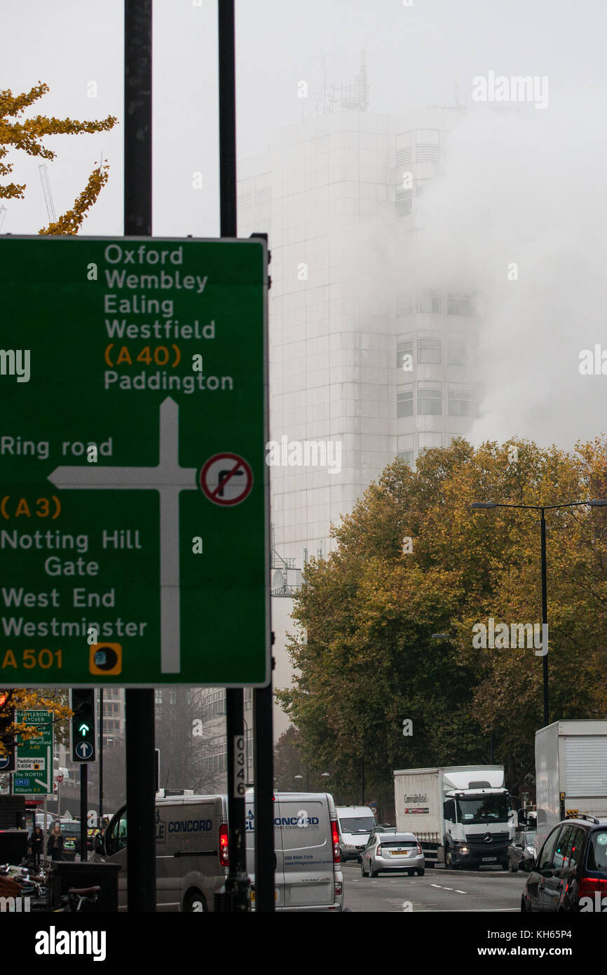 London, UK. 14th Nov, 2017. Acrid smoke rises from the roof of a tower ...